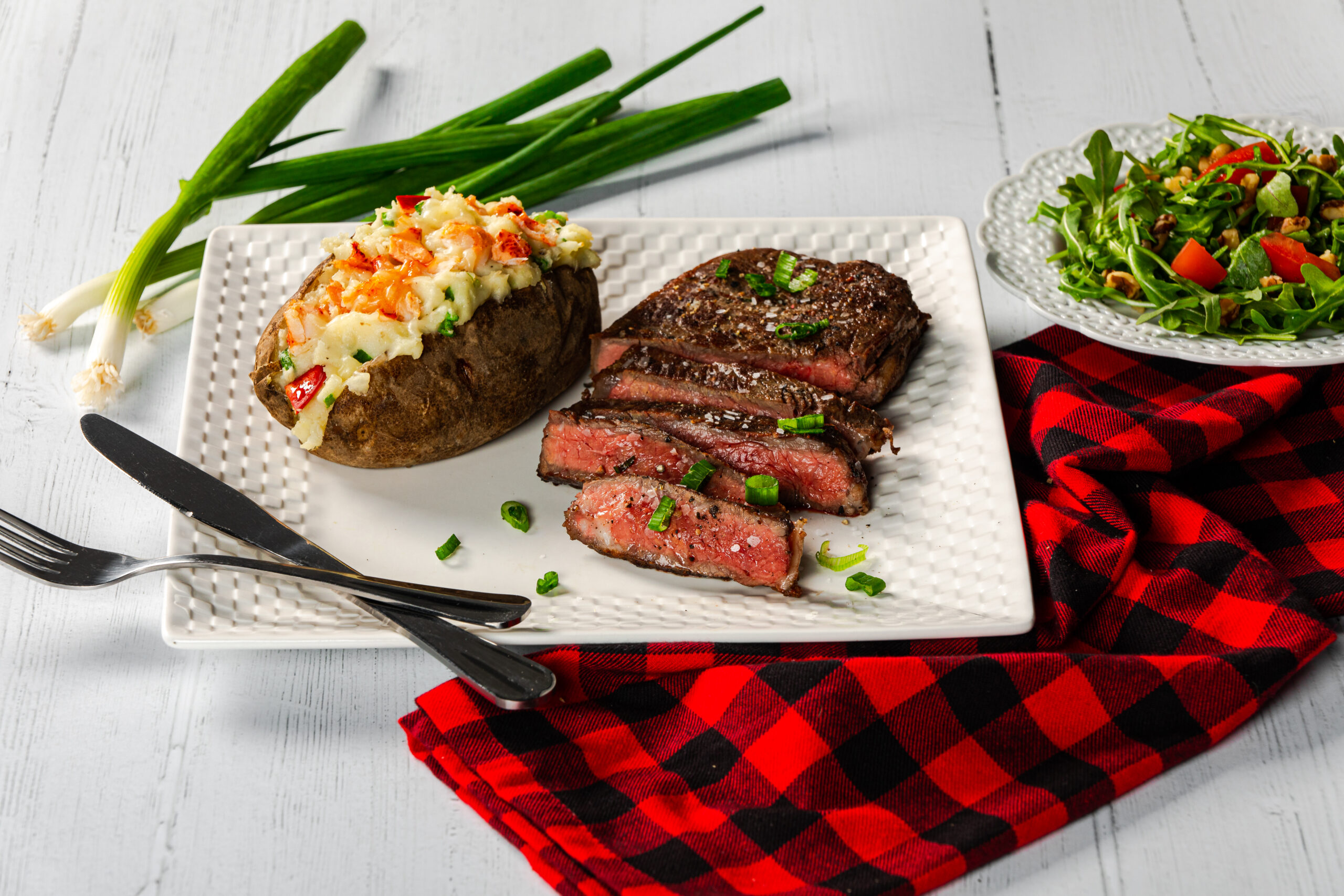 NY Strip Loin with Lobster Stuffed Baked Potato - Calgary Co-op